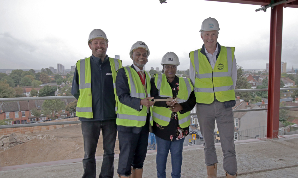 Topping out ceremony marks progress at affordable housing development ...
